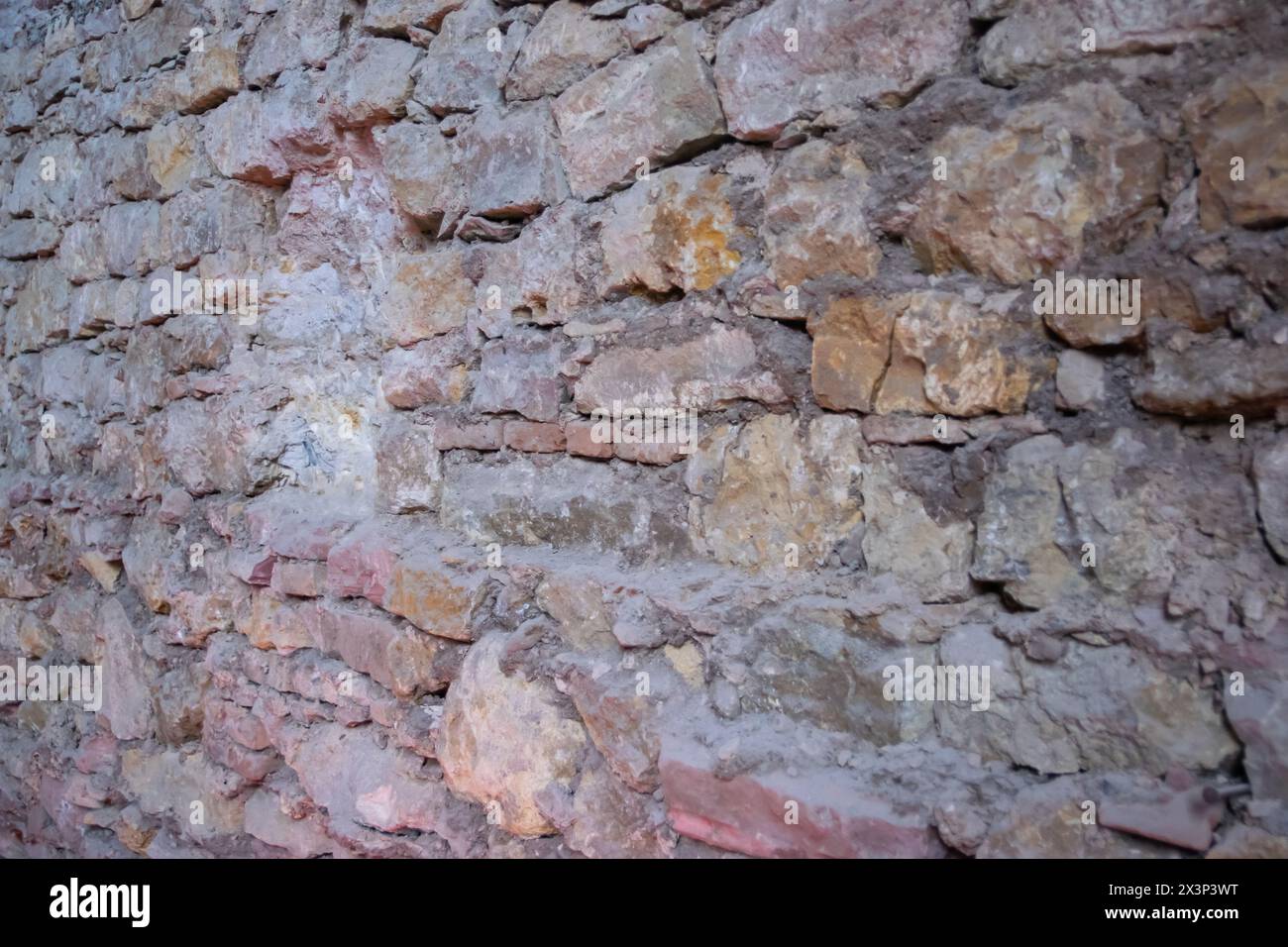 Structural stone wall of the ancient building. Gray stone tile block ...