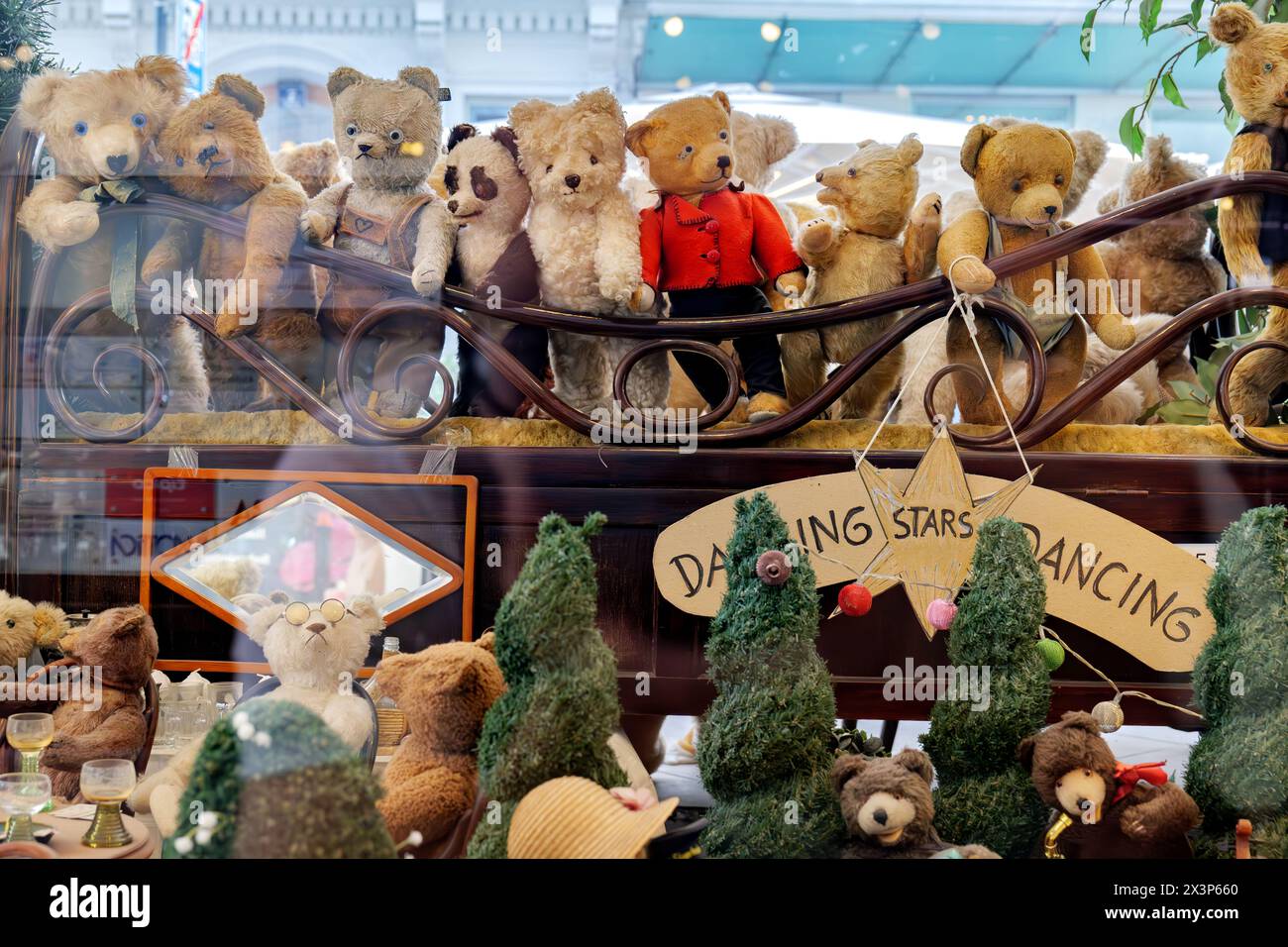 Collection of vintage teddy bears, collected in a shop window, in the ...