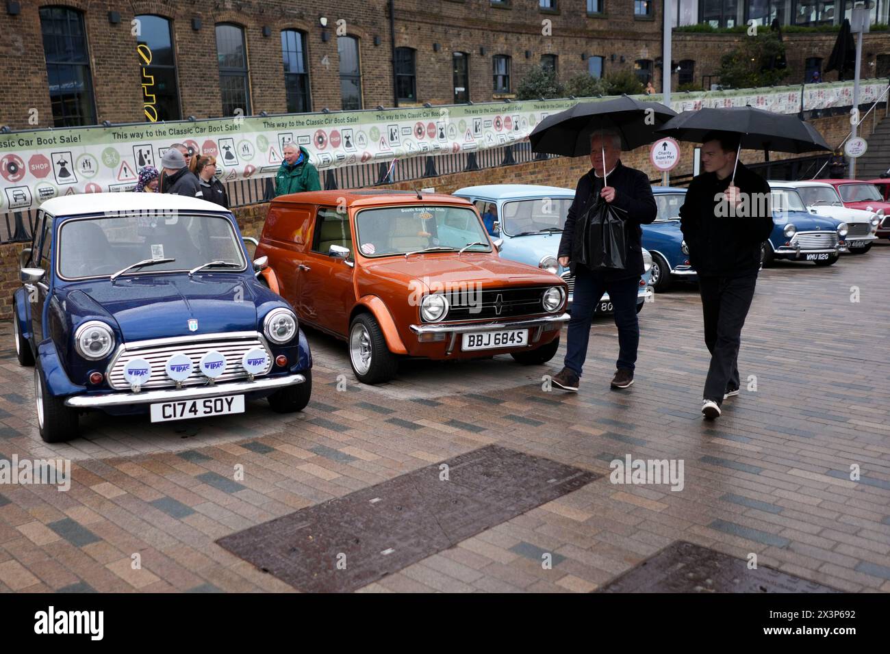 People visit a Classic Car Boot sale in the rain at Kings Cross in ...