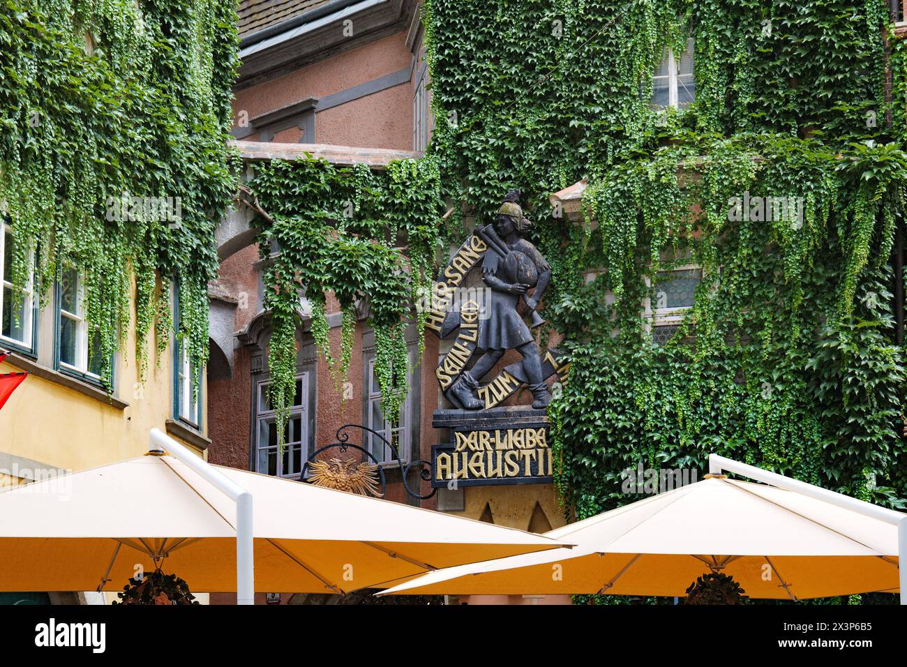 Vienna, Austria. Ancient wooden sculpture, now a restaurant sign ...