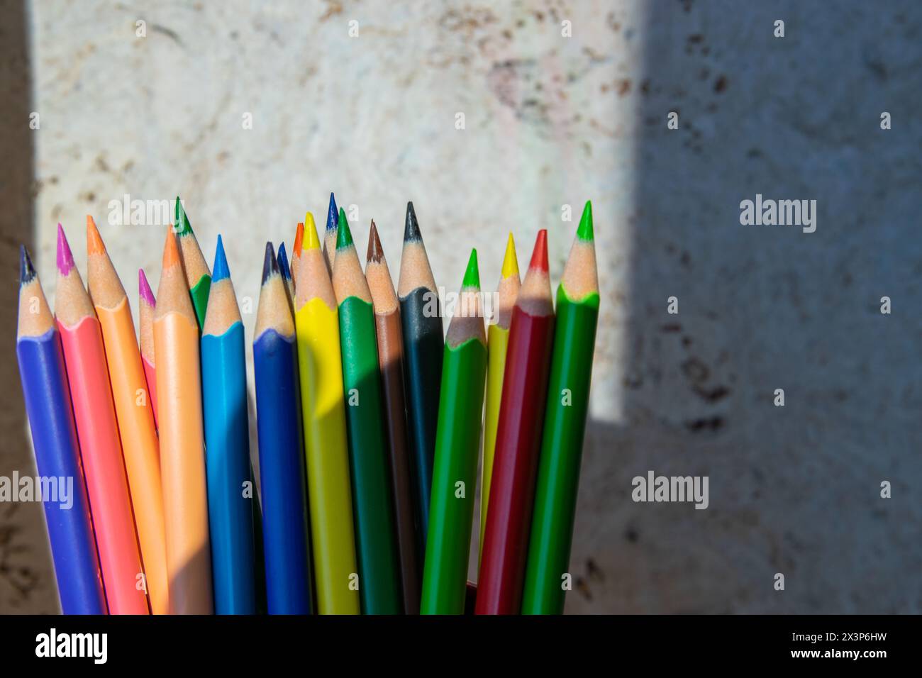 Much color pencils on the light natural cork background. Close up ...