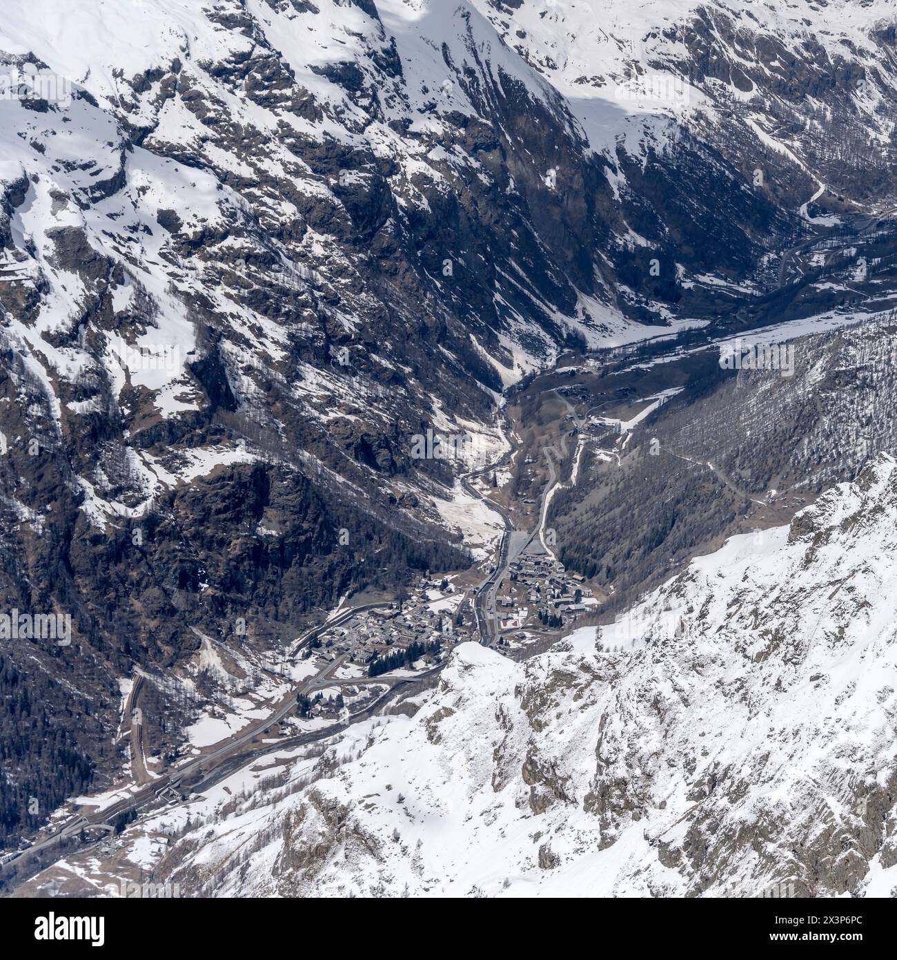 aerial cityscape, from a glider plane, with touristic Gressoney La ...
