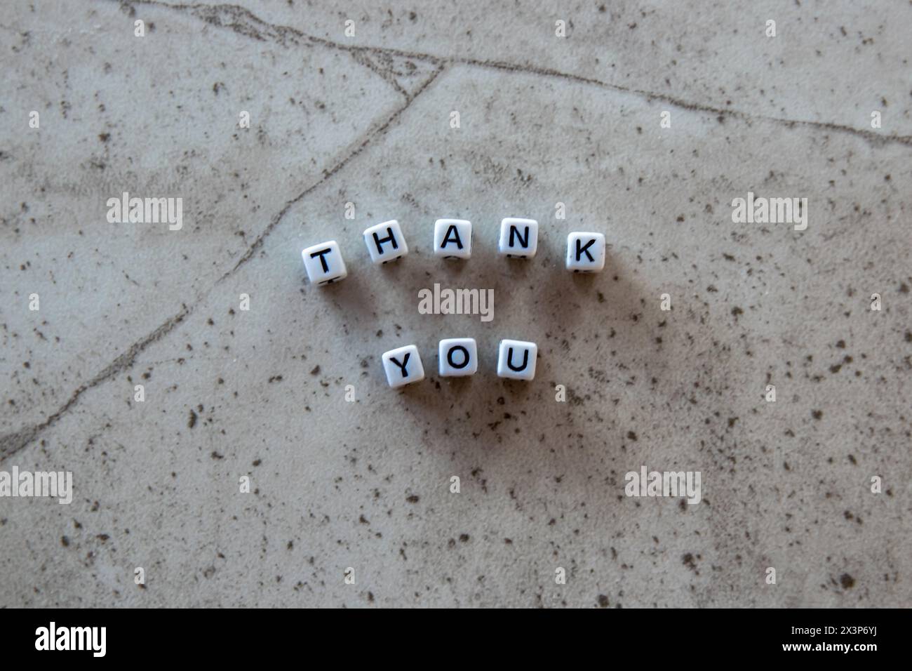 Thank you exclamation word on the stone background Stock Photo - Alamy