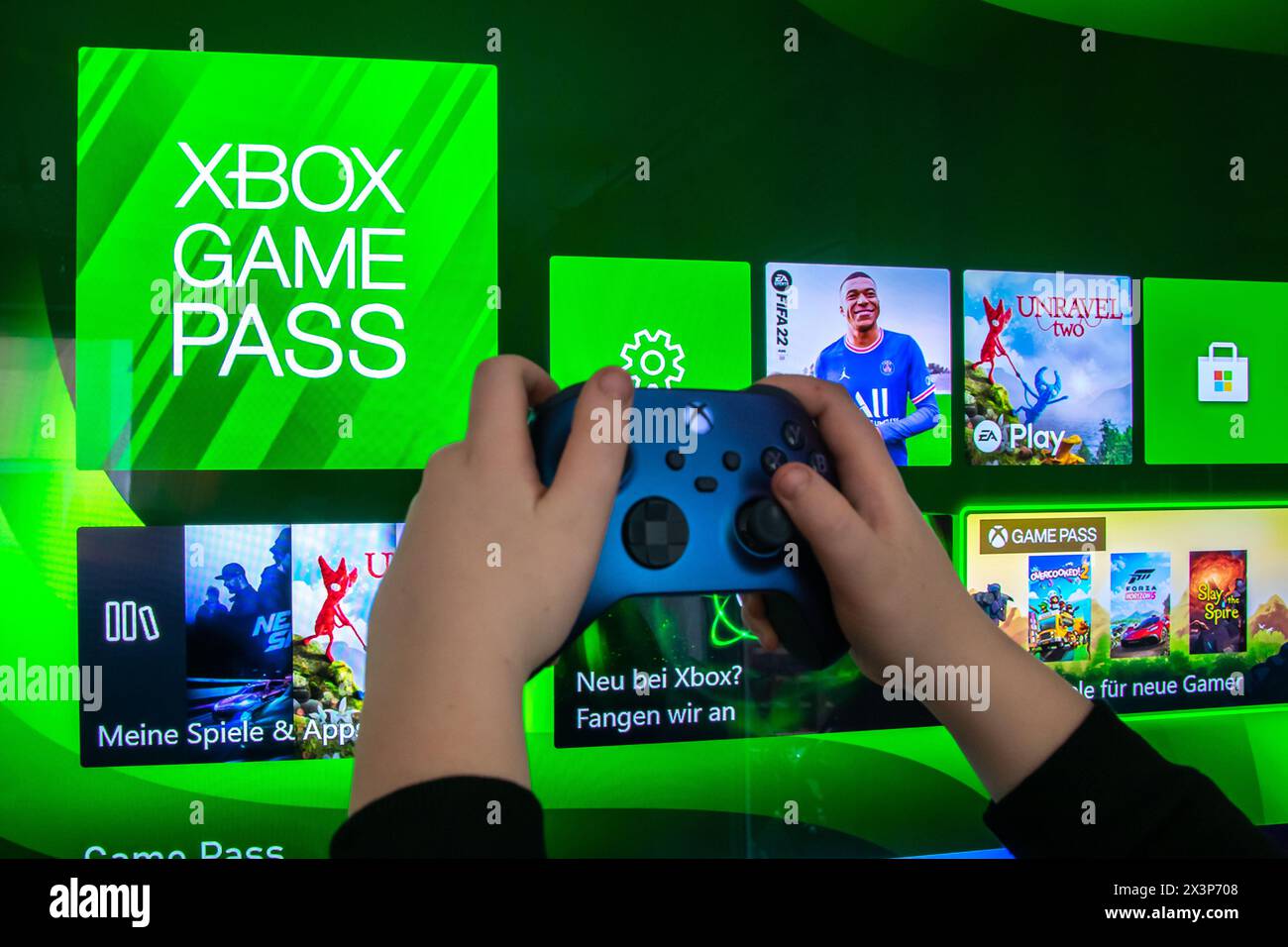 Joystick controller in the hand. Gaming consoles the Xbox Series X and ...