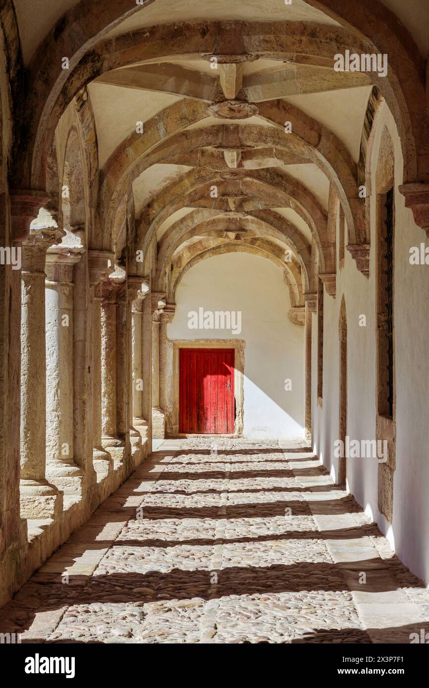 Cloister with red wooden door at Convent of Christ, Tomar Portugal ...