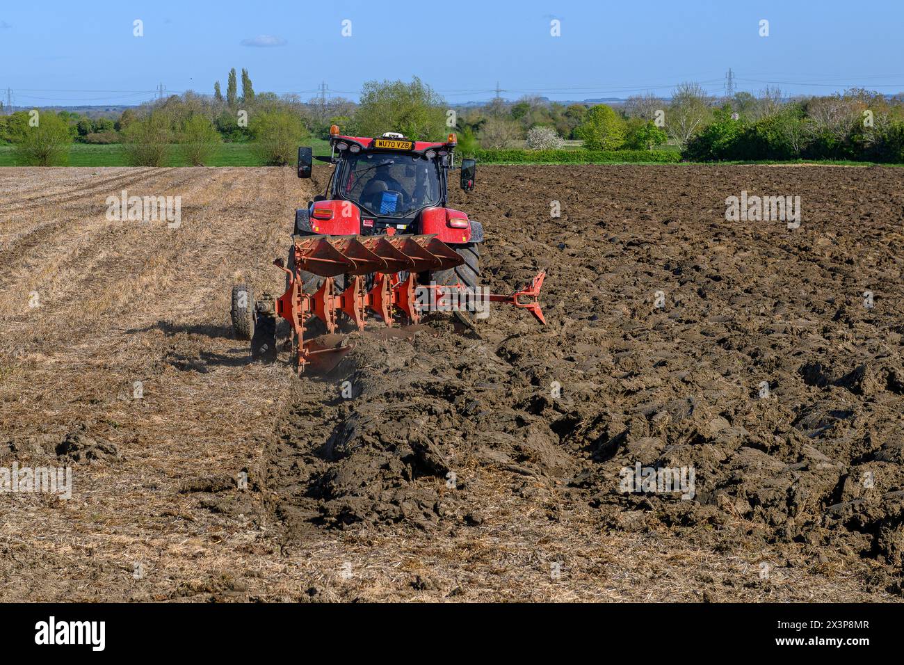 Tractor pulling plough ploughing hi-res stock photography and images ...