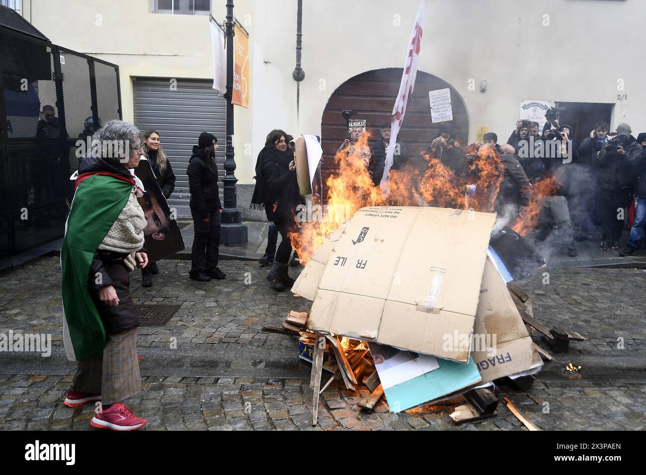 Protesters burn signs depicting g7 ministers during the environmental ...