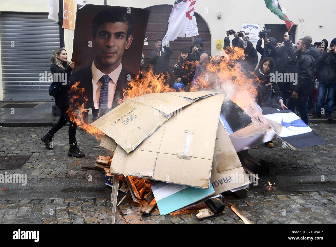 Protesters burn signs depicting g7 ministers during the environmental ...