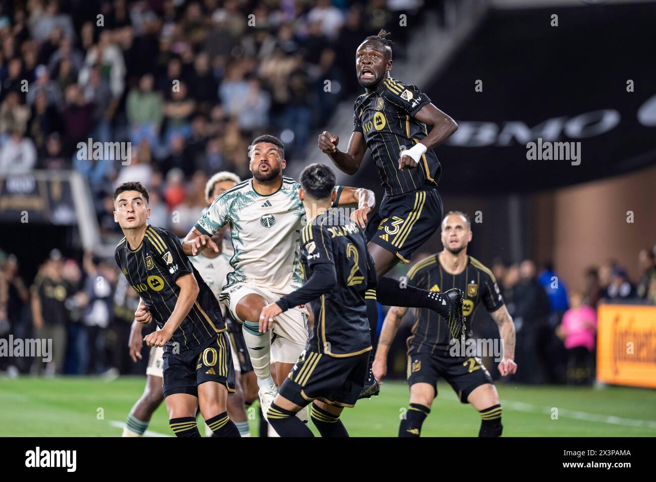 LAFC forward Ken Kamara (23) heads clear a corner kick during a MLS ...