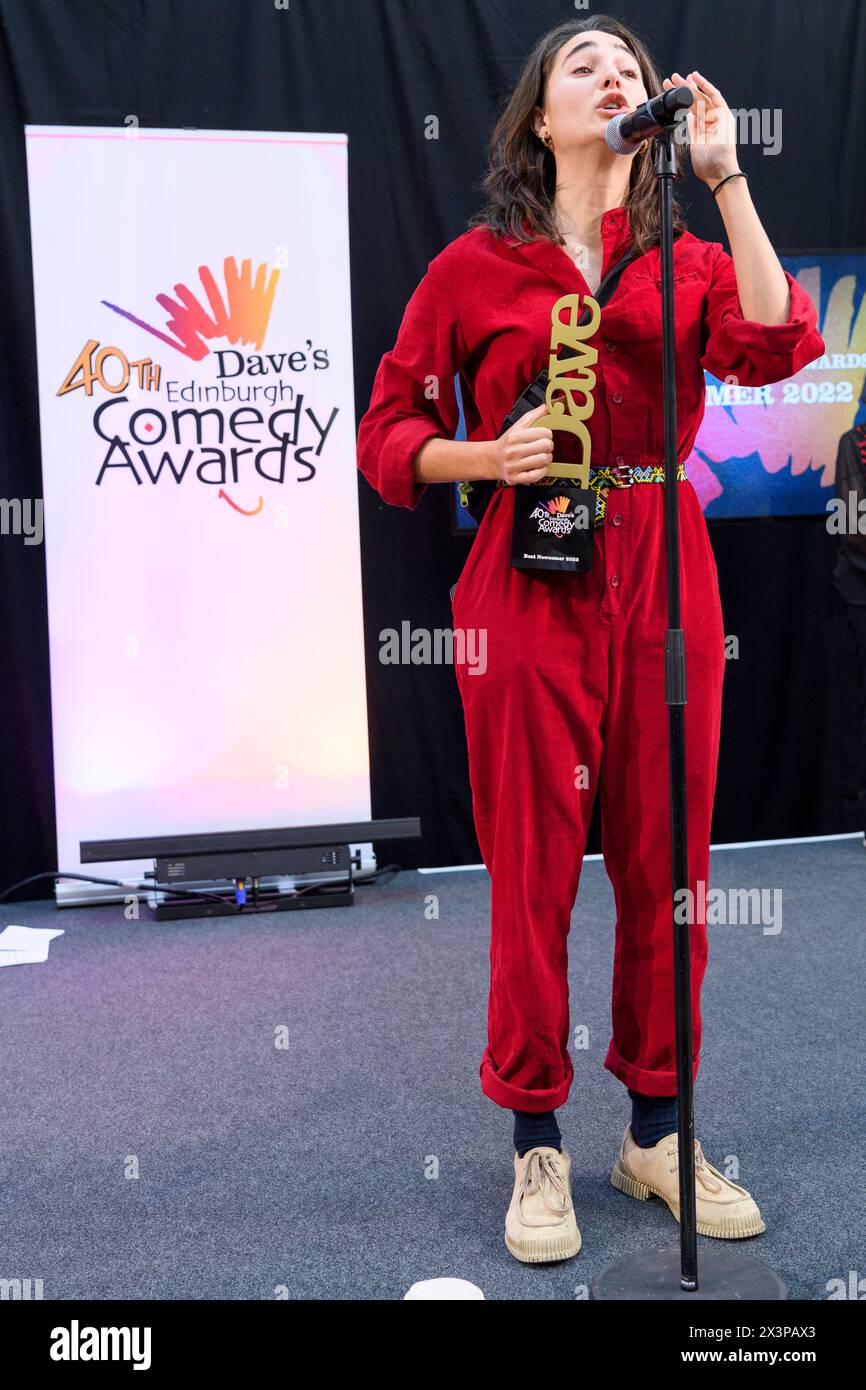 Lara Ricote, with Russell Kane (left), reacts after winning the Dave's ...