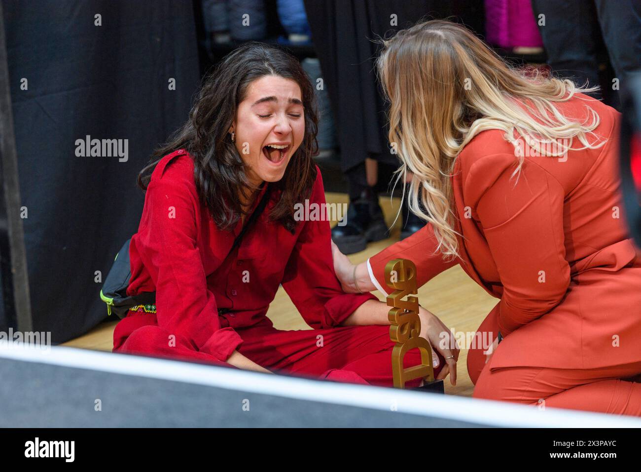 Lara Ricote, with Russell Kane (left), reacts after winning the Dave's ...