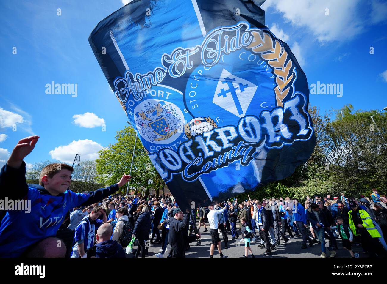 Stockport County fans celebrate during an open-top bus parade in ...