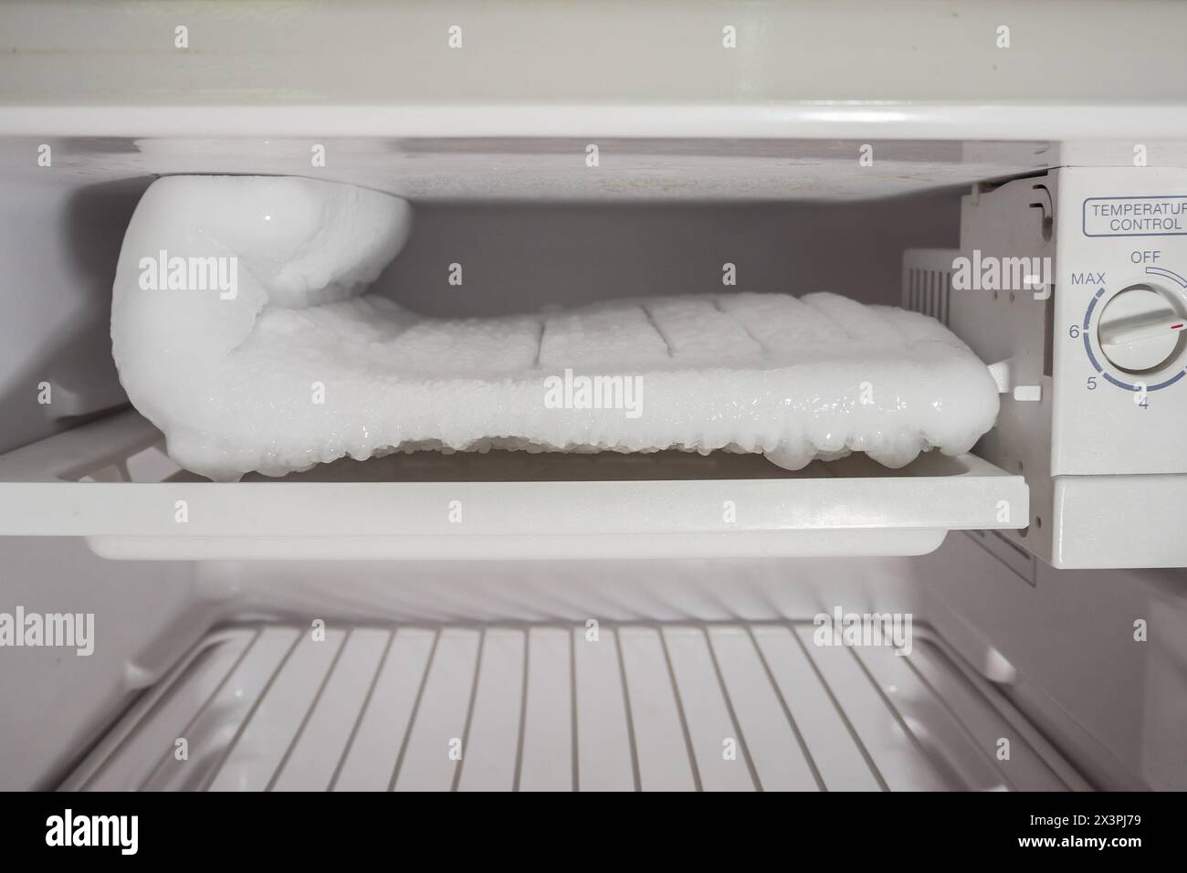 frozen Ice buildup in the freezer of refrigerator Stock Photo - Alamy