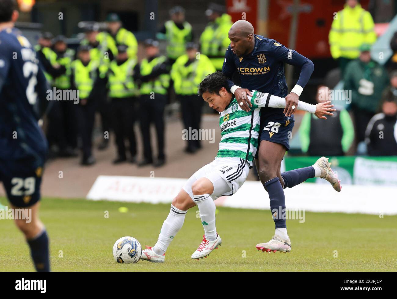 Celtic’s Reo Hatate in action against Dundee's Mohamed Sylla during the ...
