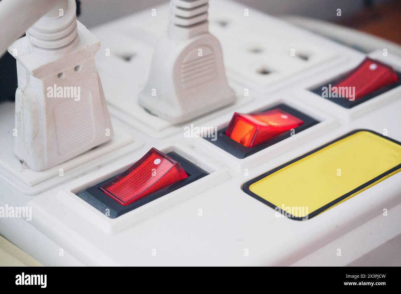 Multiple power socket with connected plugs Stock Photo - Alamy