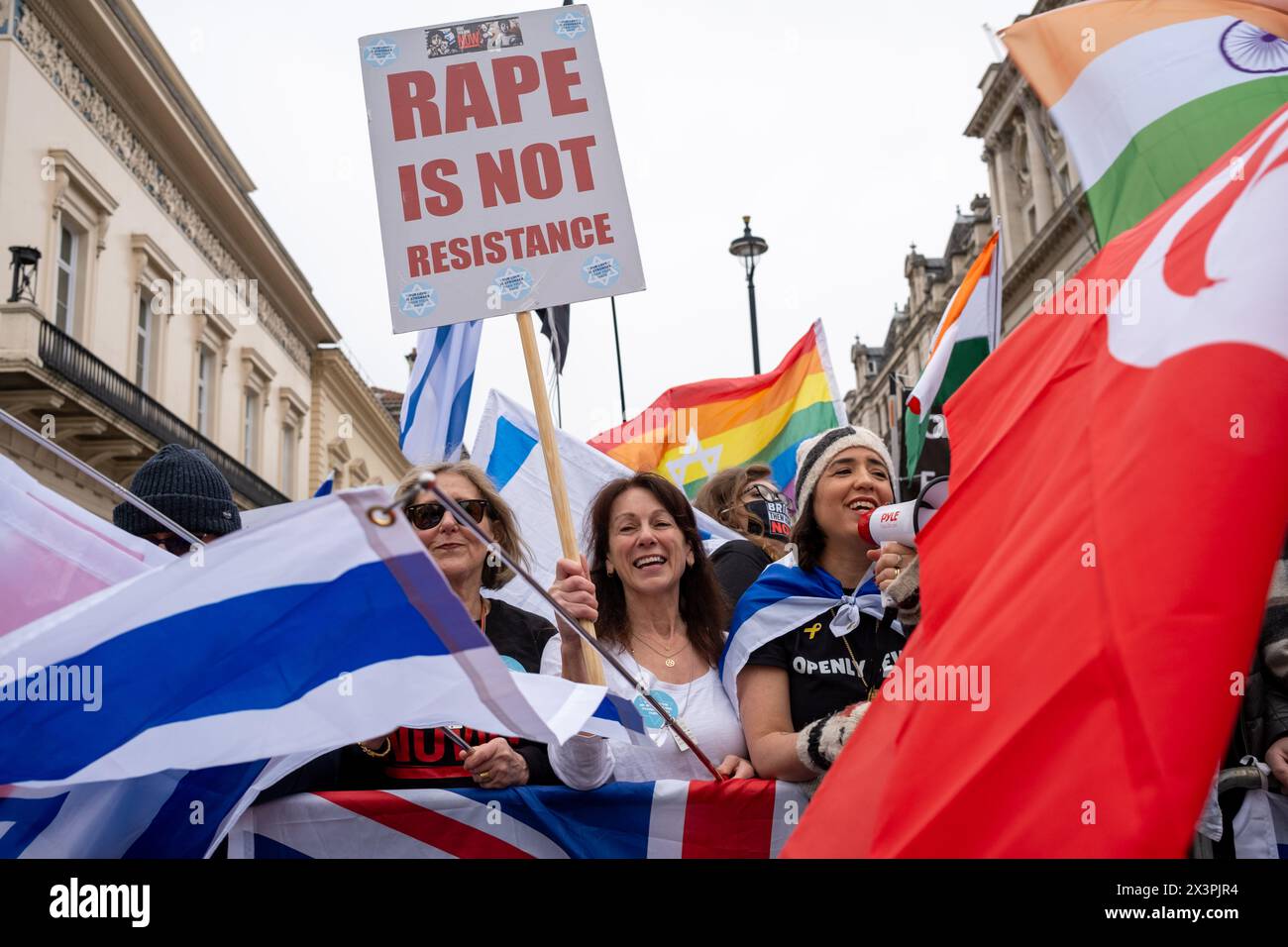 Counter protesters hold a placard and flags during the demonstration ...