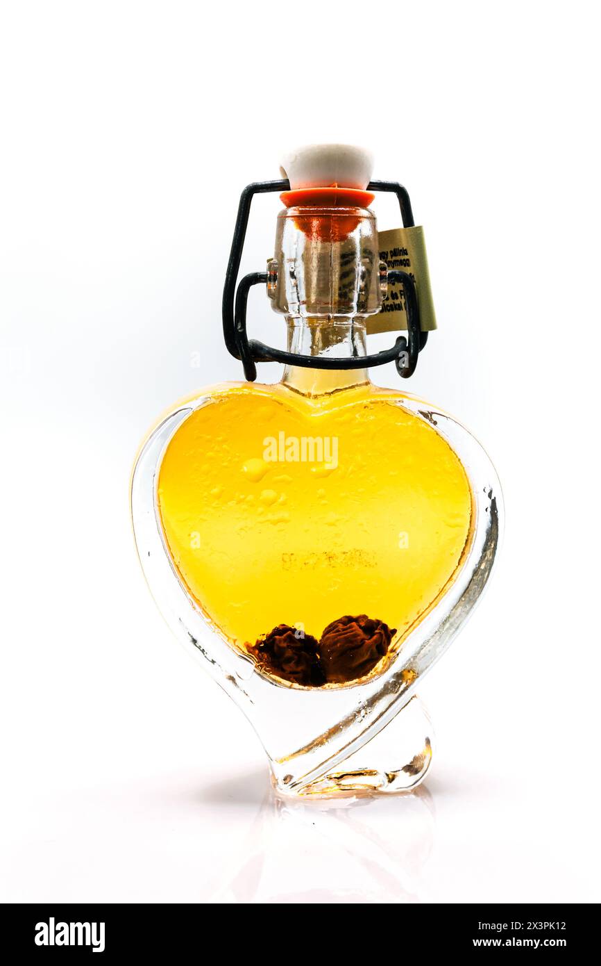 Gypsy Sour Cherry Palinka in a small heart-shaped bottle with water ...