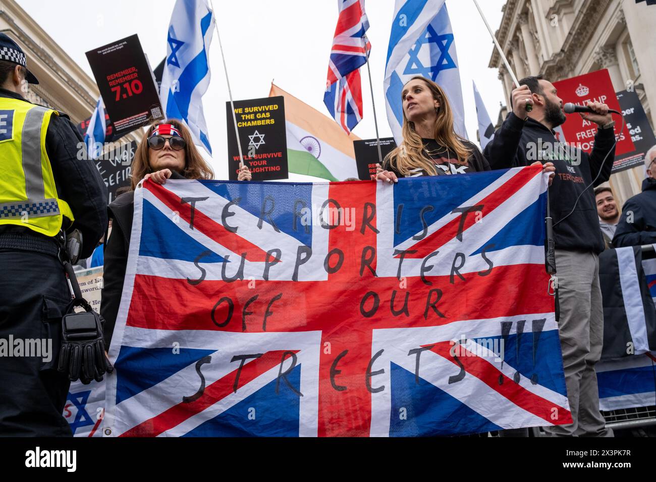Counter protestors hold a Union Flag during the demonstration. After ...