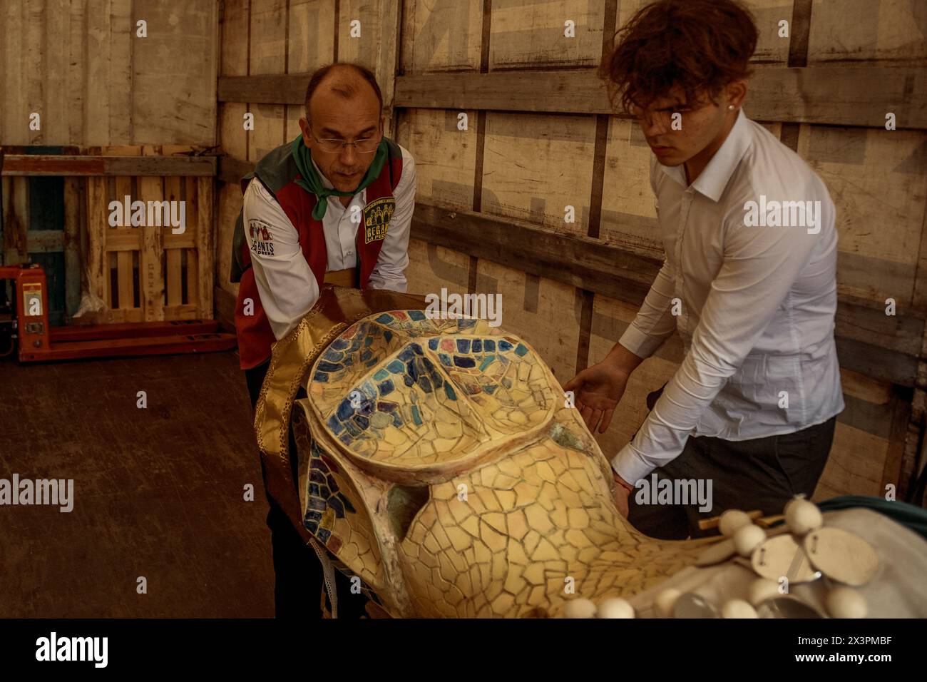 Barcelona, Spain. 28th Apr, 2024. Giant figures are loaded into a lorry ...