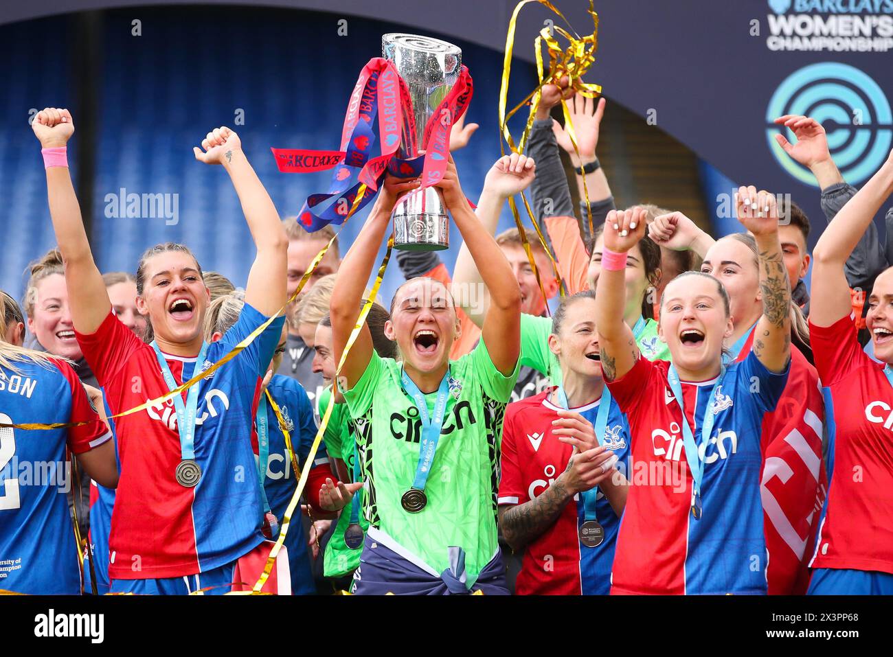Crystal Palace goalkeeper Fran Kitching celebrates by lifting the Women ...