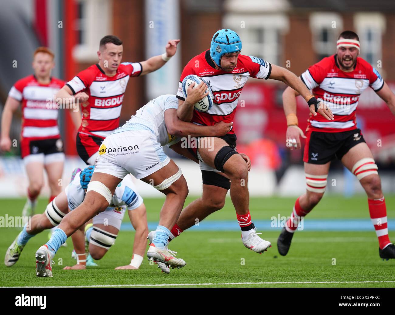 Gloucester's Zach Mercer is tackled by Exeter Chiefs' Greg Fisilau ...