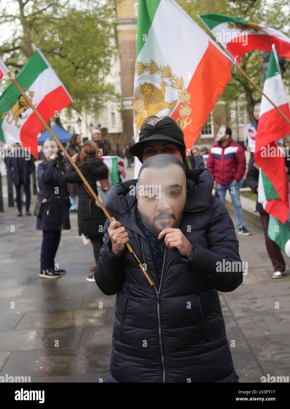 People take part in a protest opposite Downing Street, in Whitehall ...