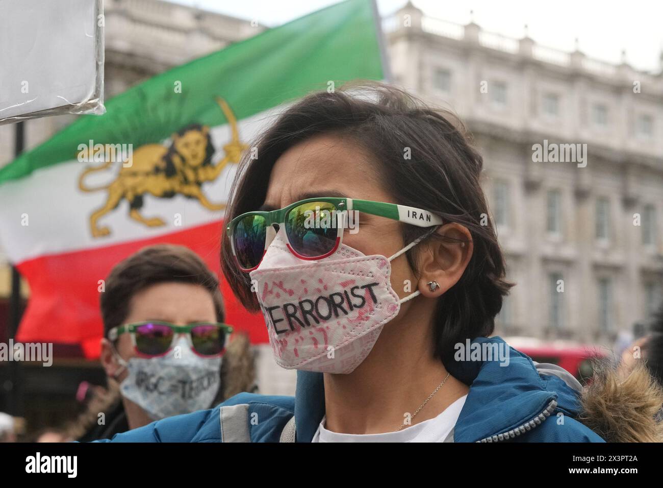 People take part in a protest opposite Downing Street, in Whitehall ...