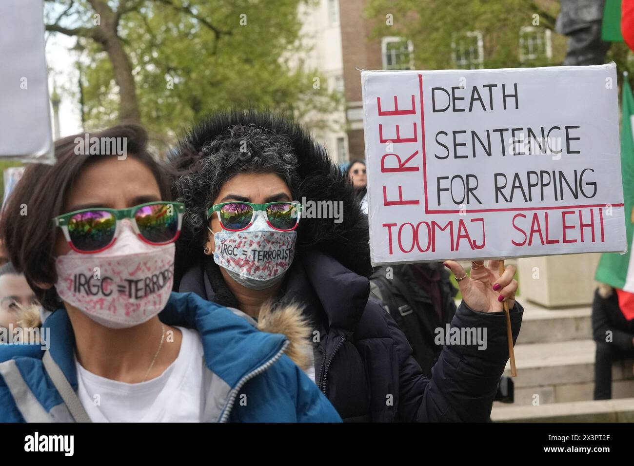 People take part in a protest opposite Downing Street, in Whitehall ...
