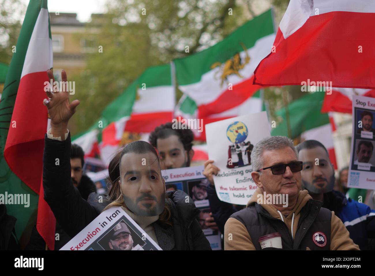 People take part in a protest opposite Downing Street, in Whitehall ...