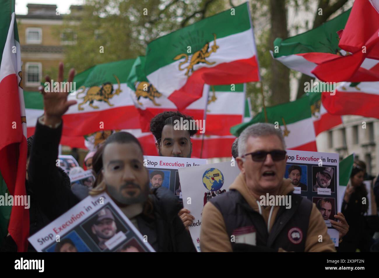 People take part in a protest opposite Downing Street, in Whitehall ...