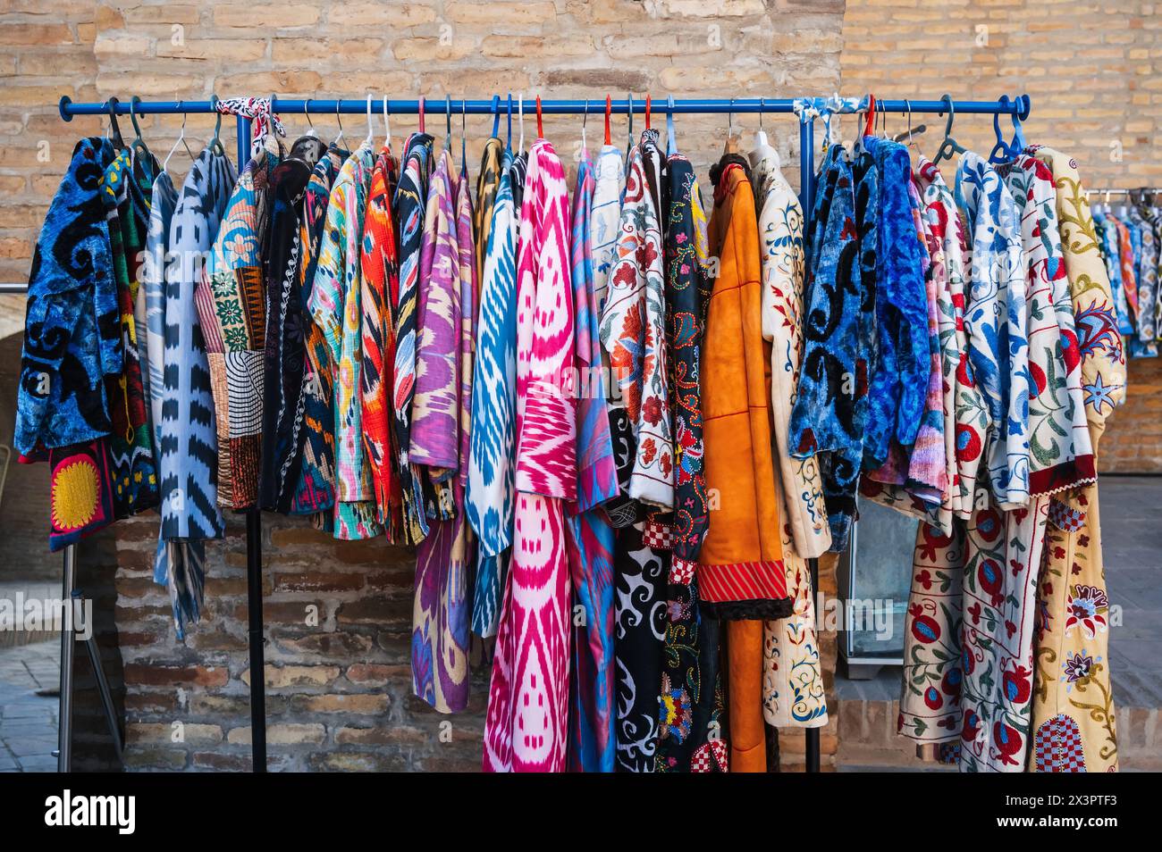 colorful traditional Uzbek dresses at an oriental street bazaar in ...