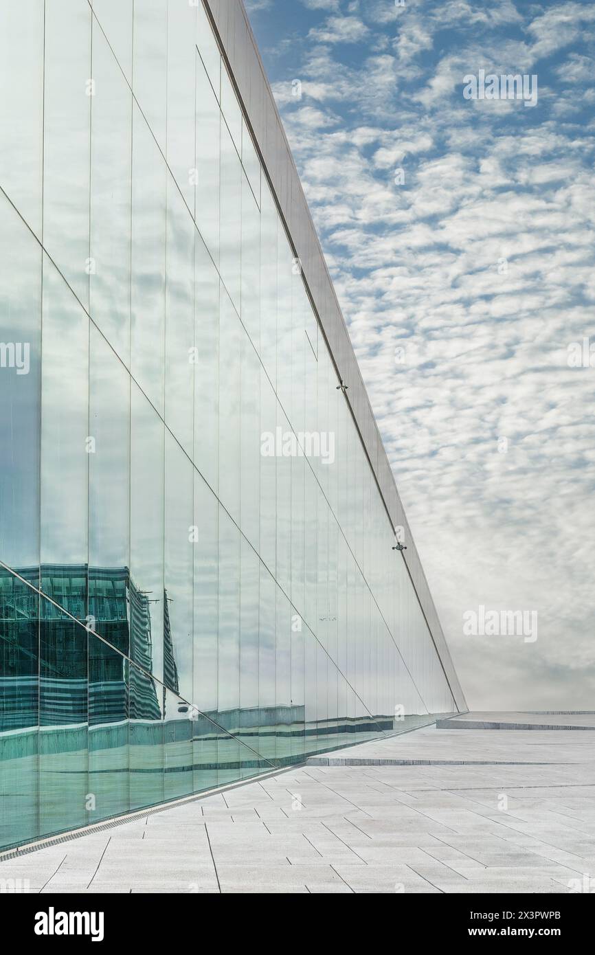 The Oslo Opera House glass facade and wide stone terrace, reflections ...