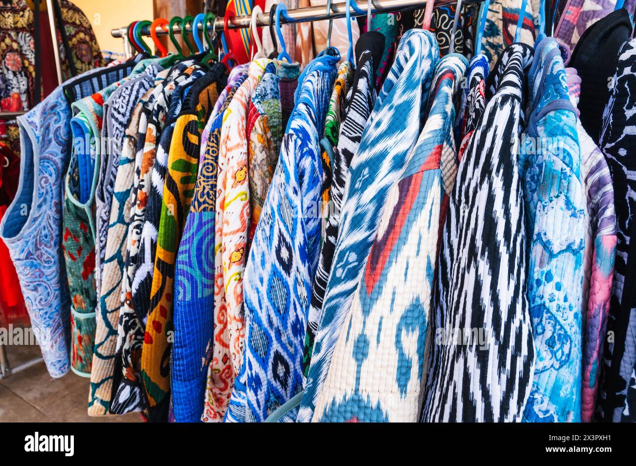 traditional Asian Uzbek dresses with colorful pattern at oriental ...