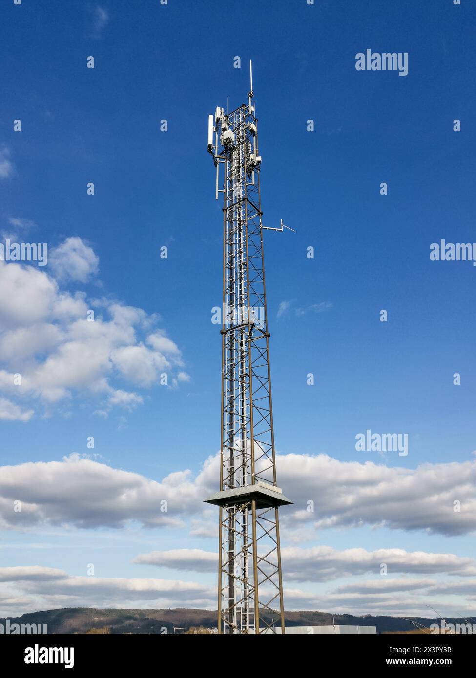 A telecommunication tower with different kinds of antennas on top ...