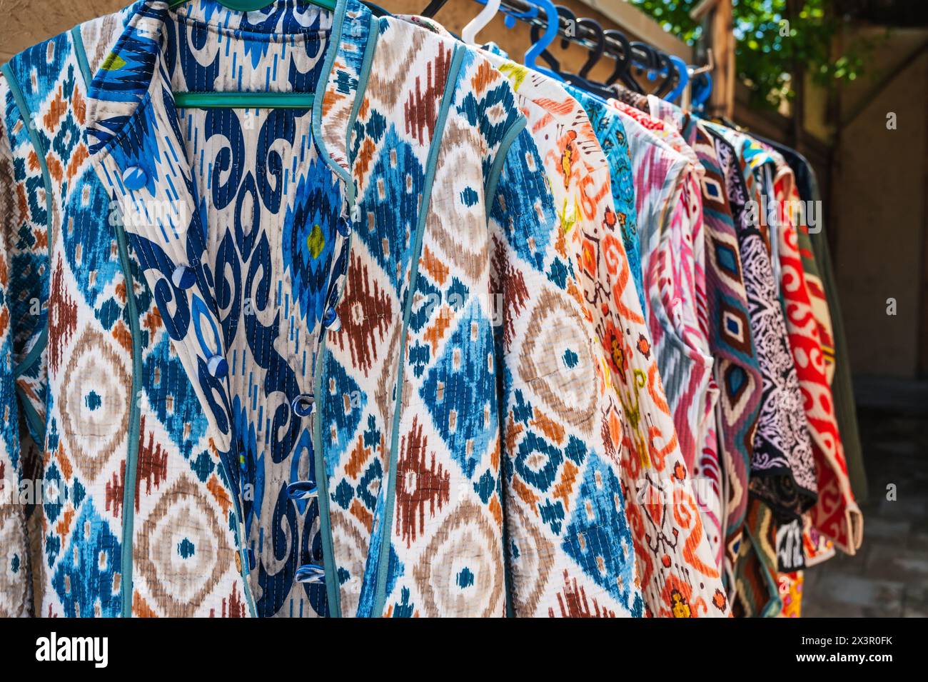 traditional Uzbek dresses and female clothes at oriental bazaar in ...