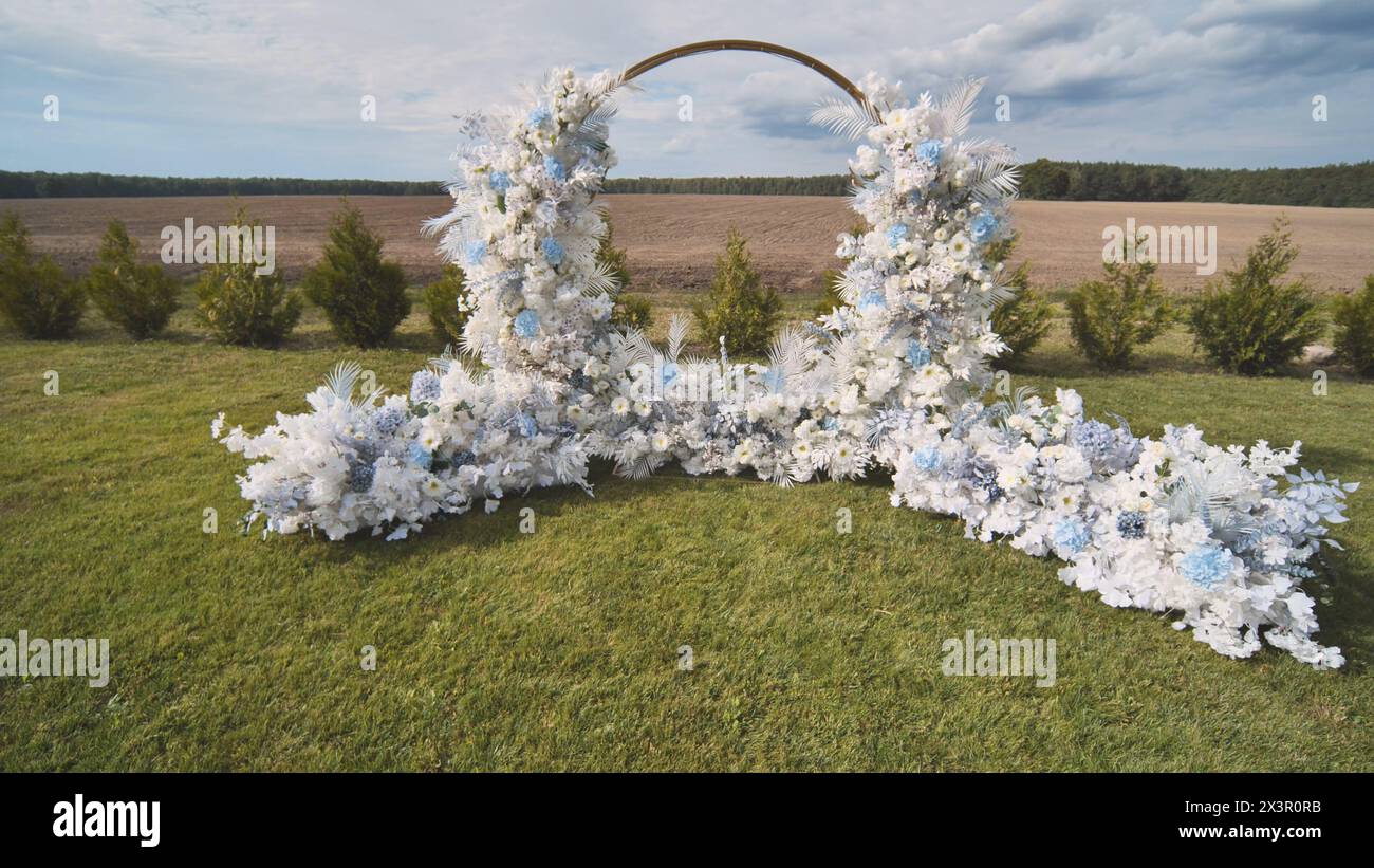 White wedding arch before the ceremony Stock Photo - Alamy