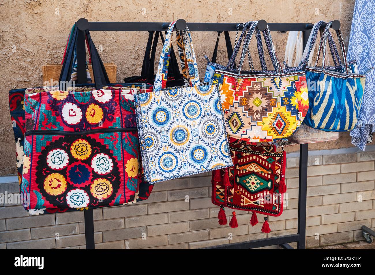 fabric bags with a traditional bright colorful pattern at the oriental ...