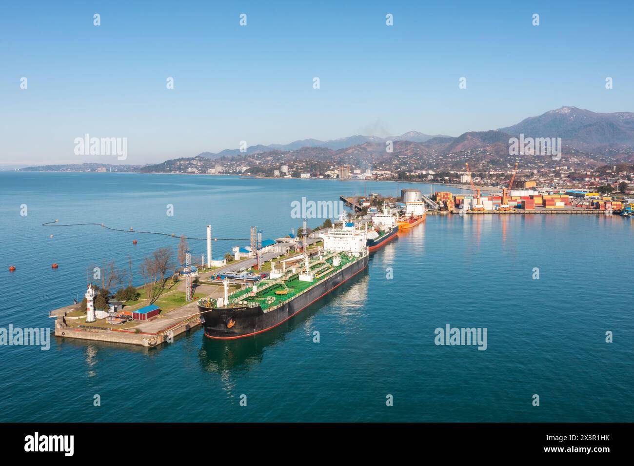 Aerial view industrial cargo and oil port with ship tanker vessel ...