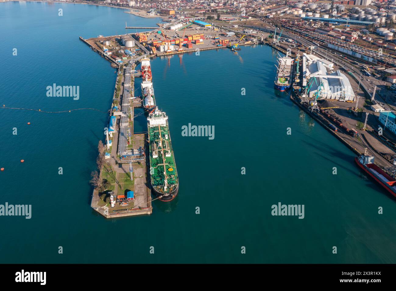 Aerial view industrial cargo and fuel port with ship tanker vessel ...
