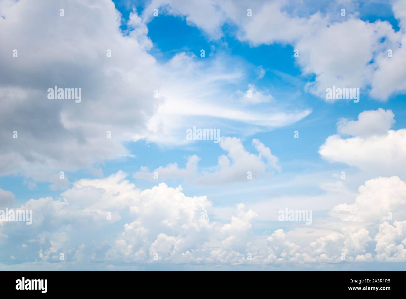 Beautiful white fluffy cloud on blue sky background Stock Photo - Alamy