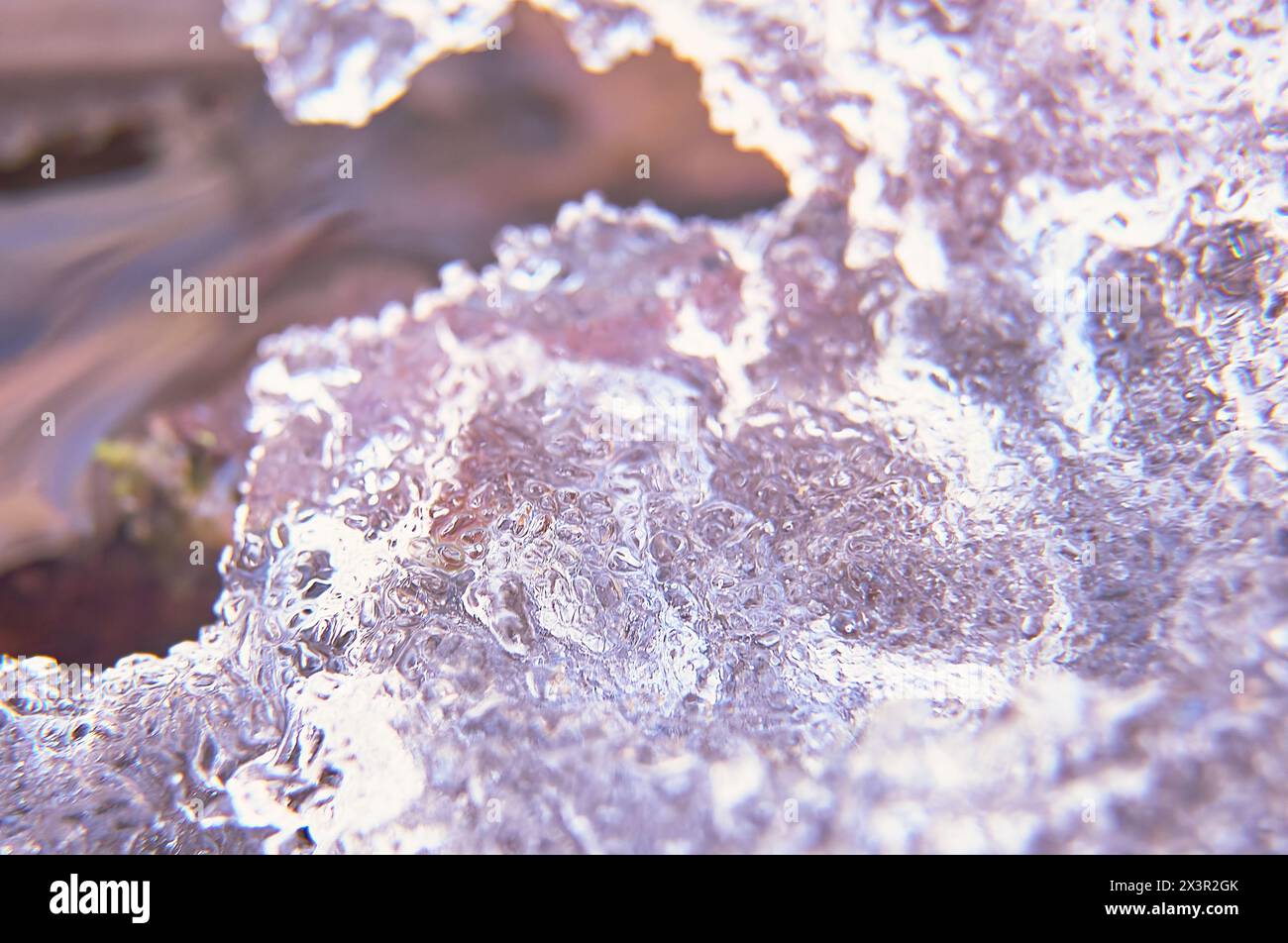 Detail of ice blocks, over mountain stream. blurred background, macro ...
