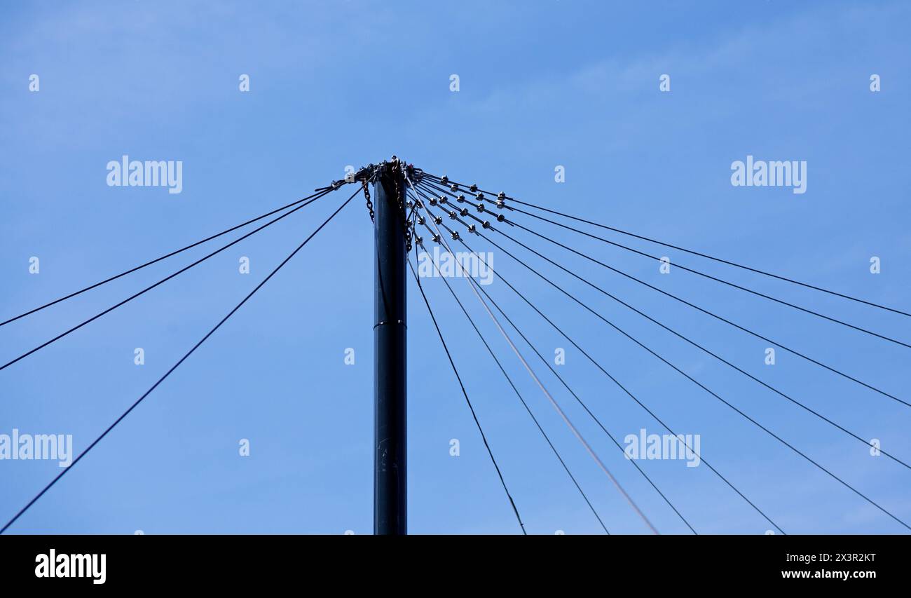 metal pole with lots of wires running in different directions Stock ...