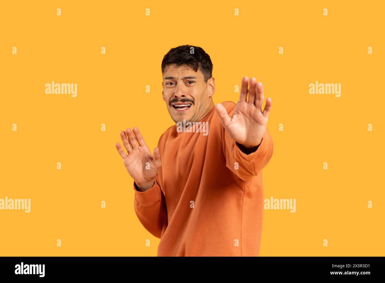 Man Standing in Front of Yellow Background Stock Photo - Alamy