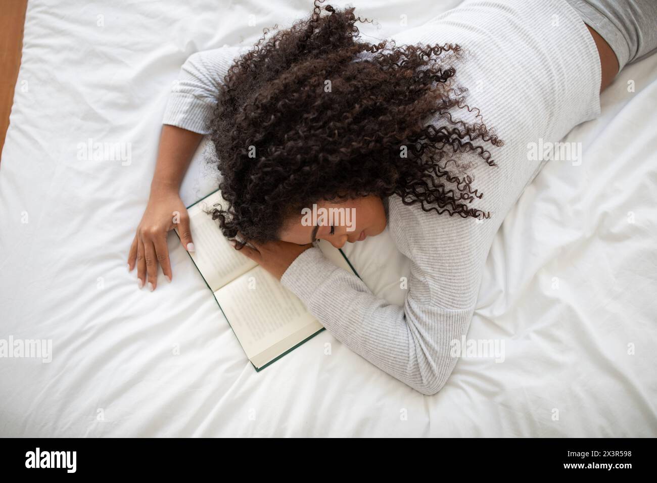 Woman sleeping open book hi-res stock photography and images - Alamy