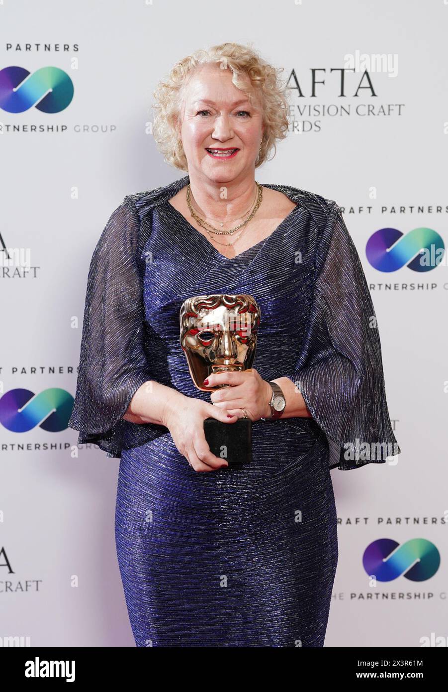 Amanda Bernstein holds her award for Production Design at the Bafta ...