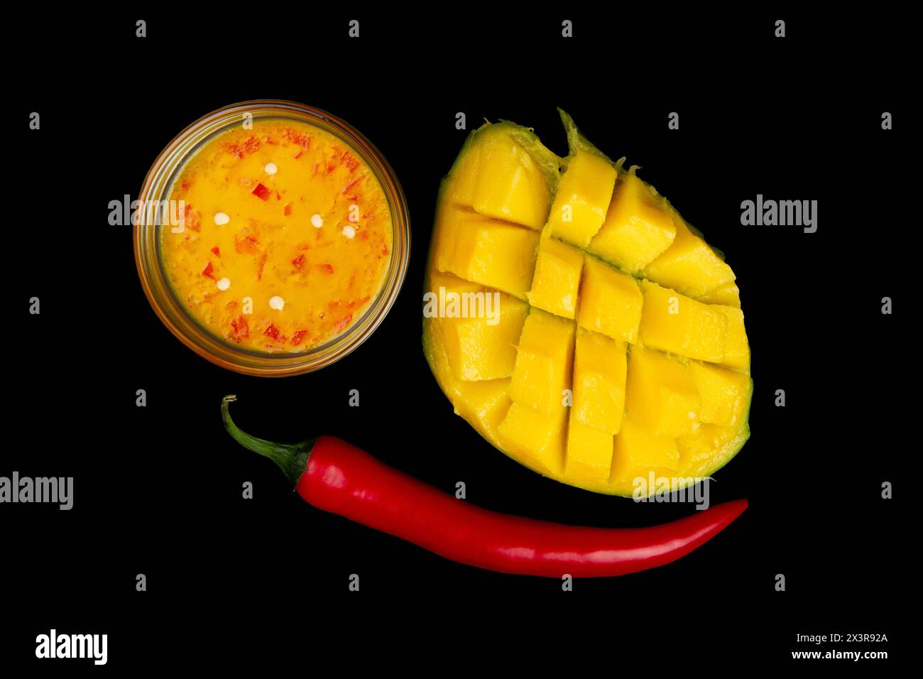 Chili pepper, cutted mango and mango chili sauce isolated on solid ...