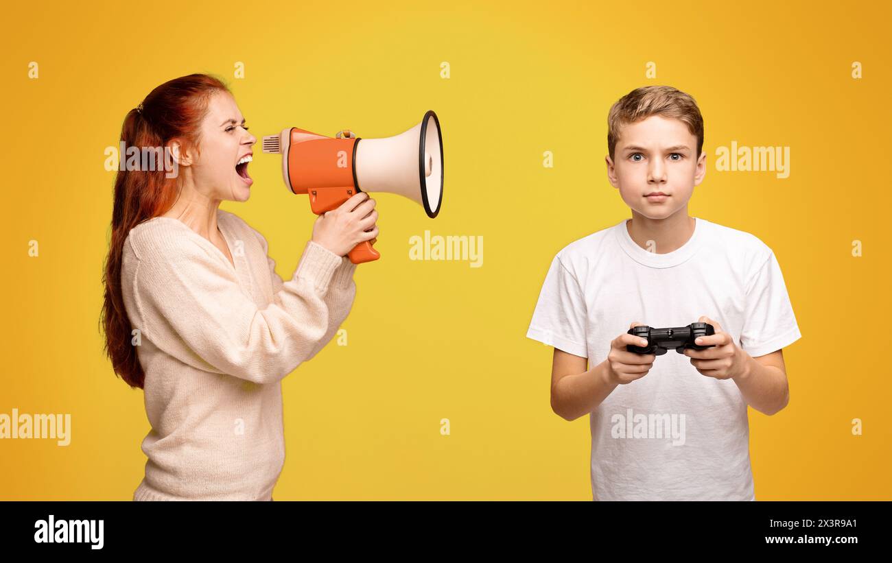 Mother shouting through megaphone at boy with joystick Stock Photo - Alamy