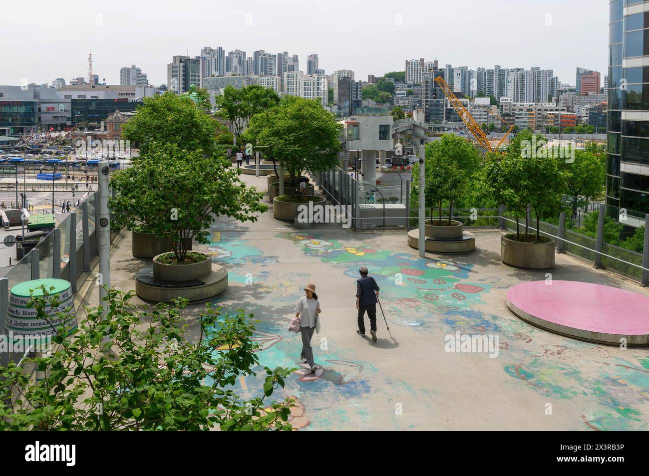 People walk on Seoullo 7017, a Linear Park in Seoul. Seoullo 7017, also known as the Seoul ...