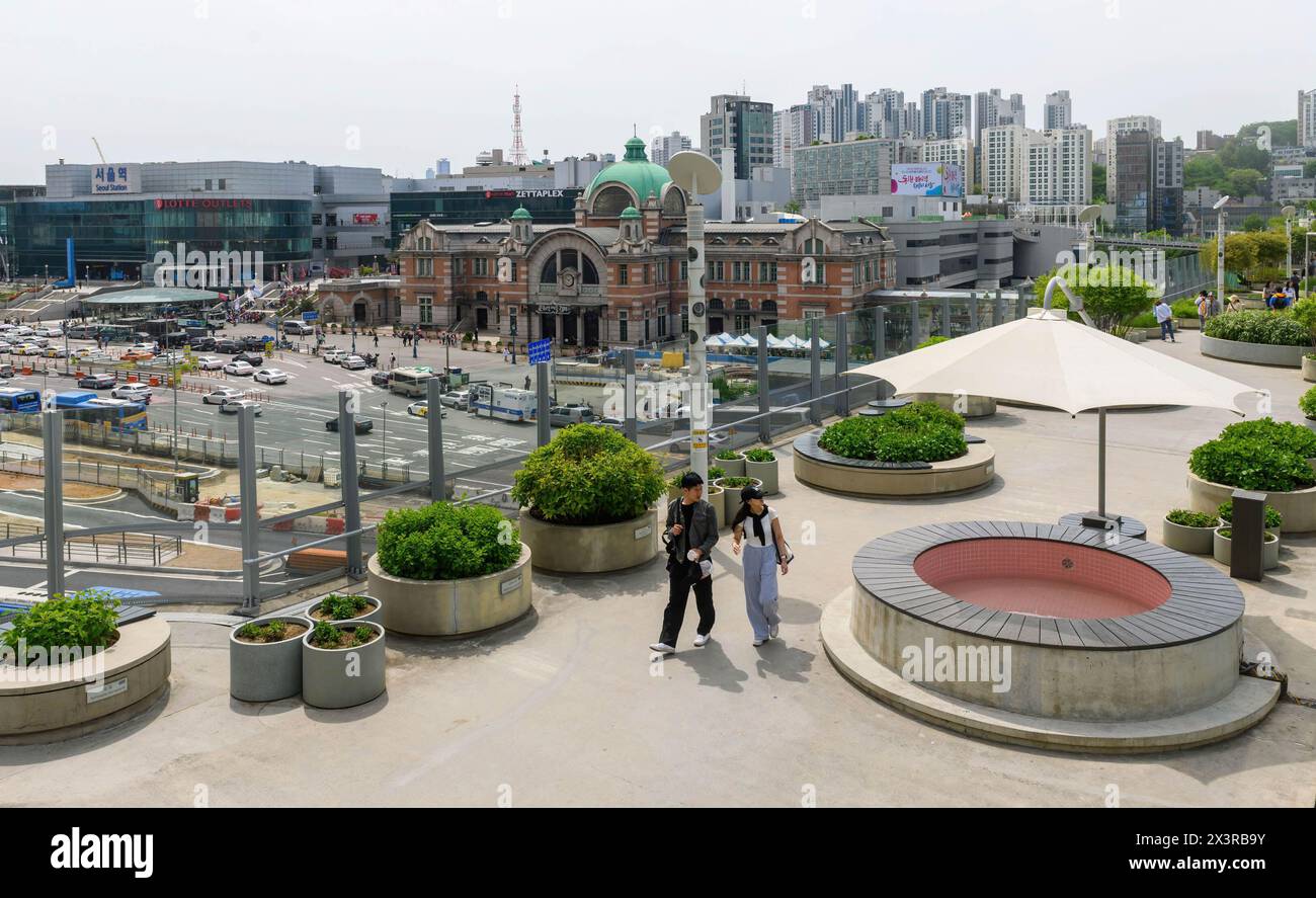 People walk on Seoullo 7017, a Linear Park in Seoul. Seoullo 7017, also ...