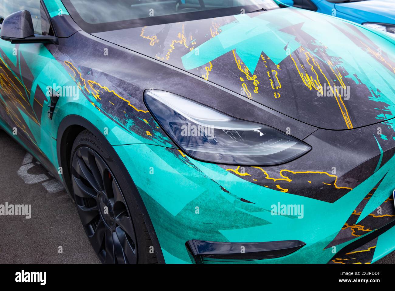 close-up detail green Tesla electric cars on parking lot, Automotive ...